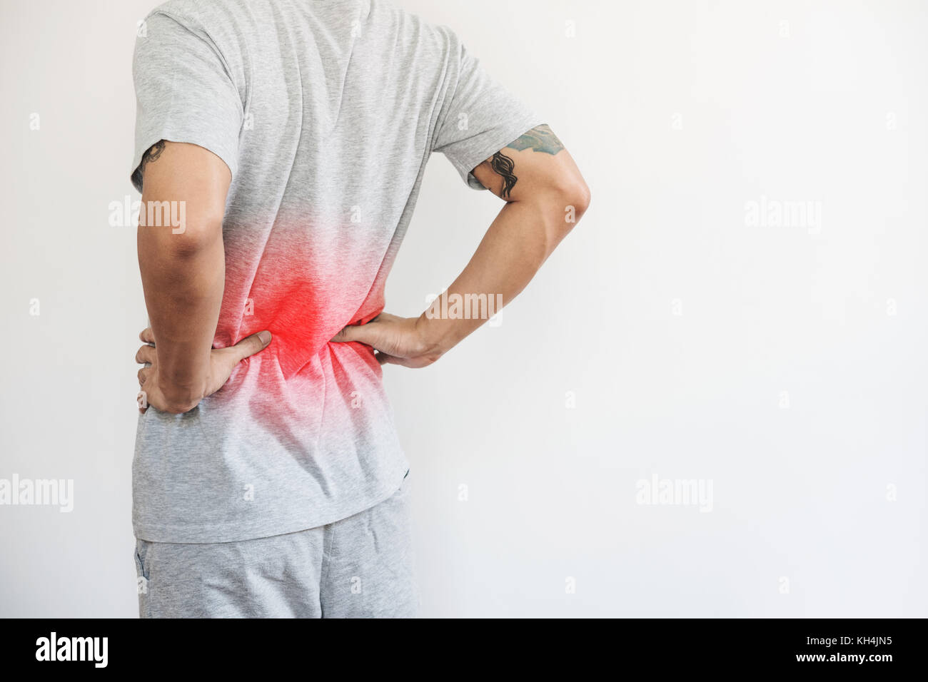 a man touching his back, with red highlight. Back pain, backache and ...
