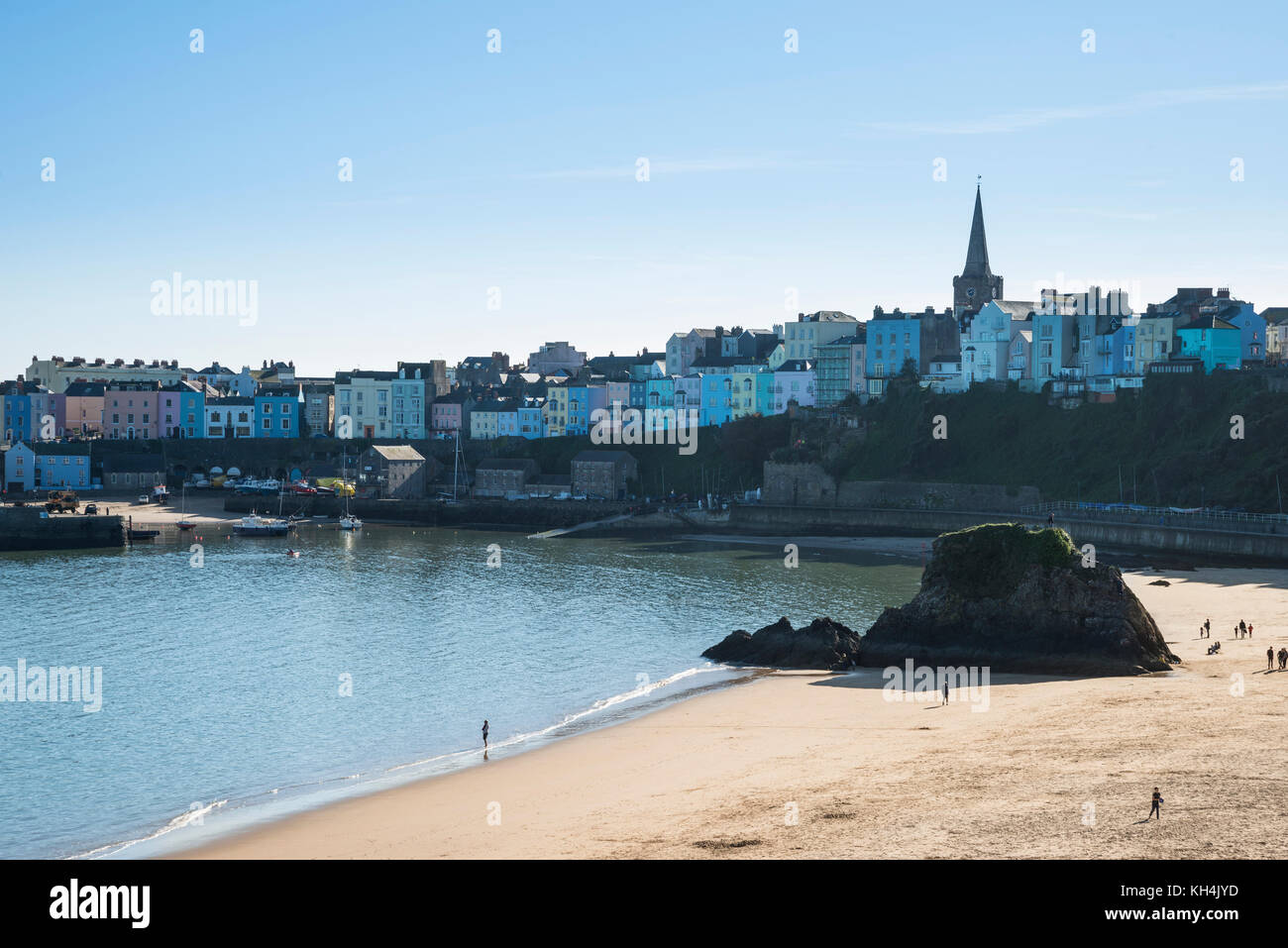 Beautiful landscape image of Tenby Harbour and beach in bright sunlight ...