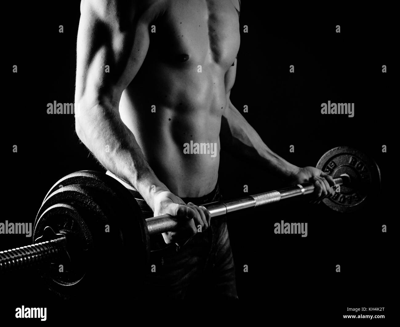 the young well-trained man has muscles Stock Photo - Alamy