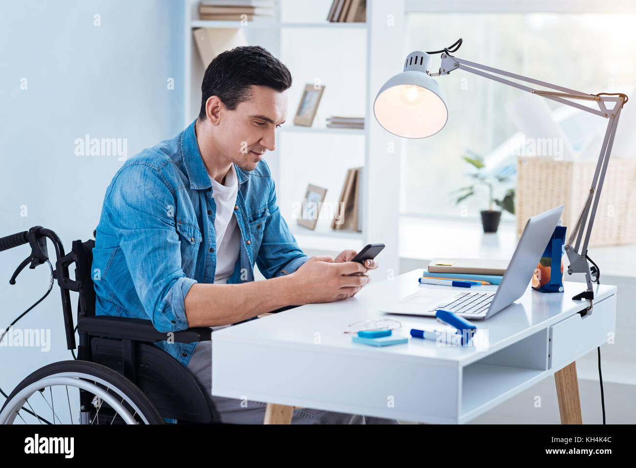 Delighted brunette man checking his email Stock Photo - Alamy