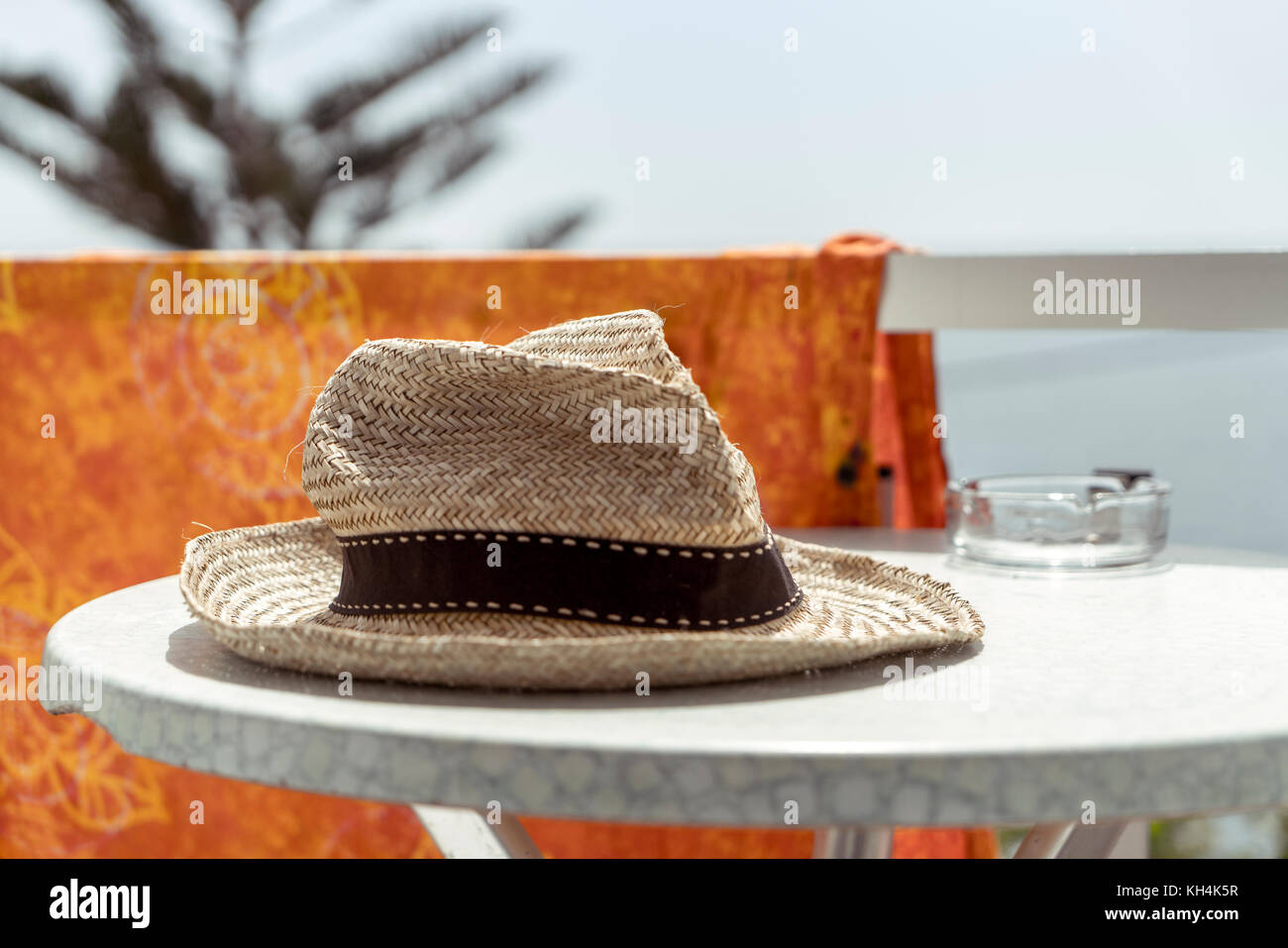 old straw hat on a table Stock Photo - Alamy