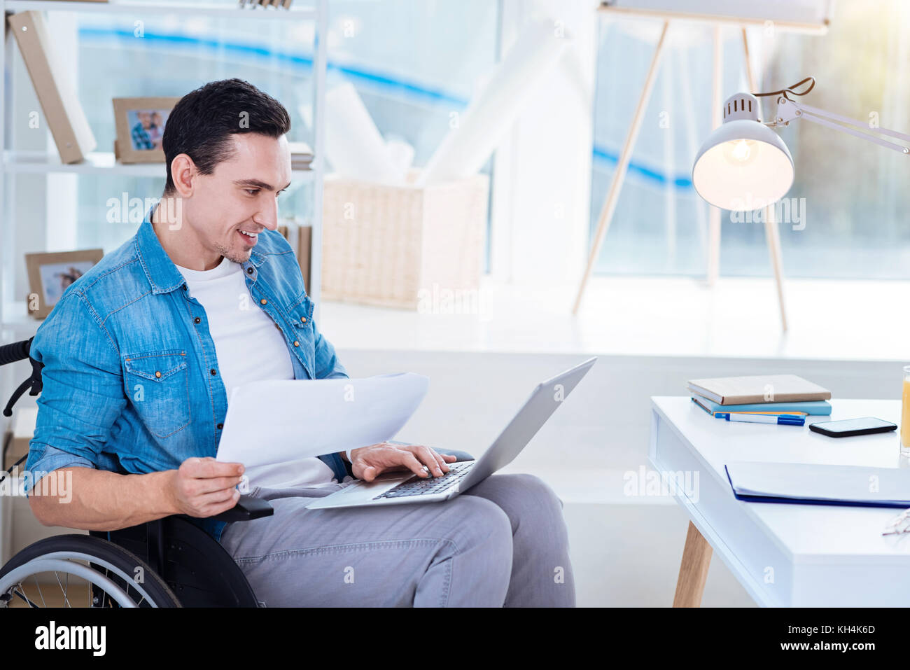 Profile photo of positive man that typing document Stock Photo - Alamy