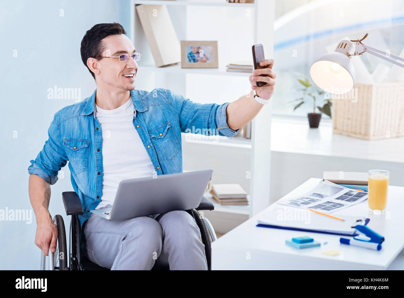 Attractive invalid man making photo Stock Photo - Alamy