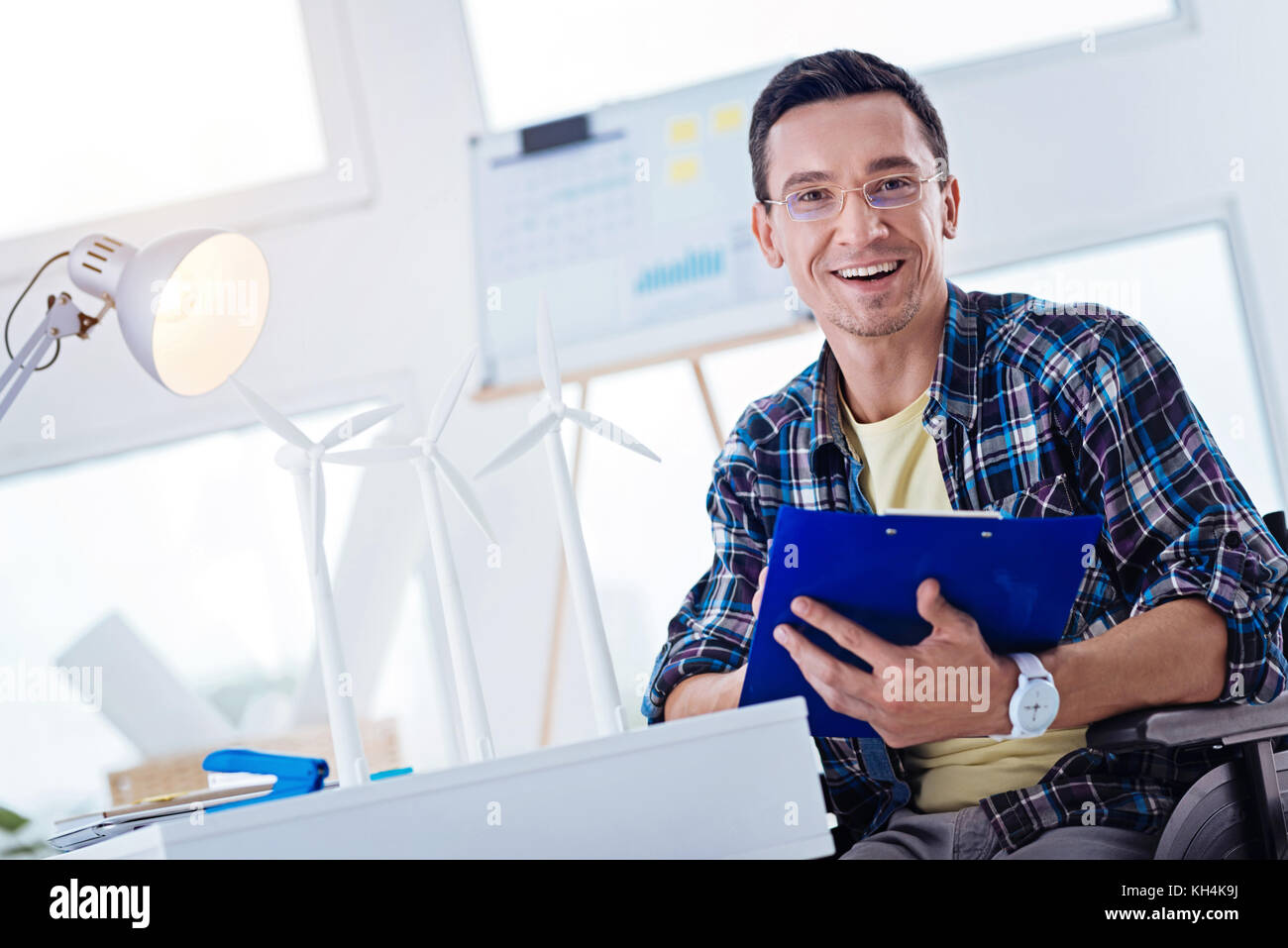 Smiling engineer being at his workplace Stock Photo - Alamy