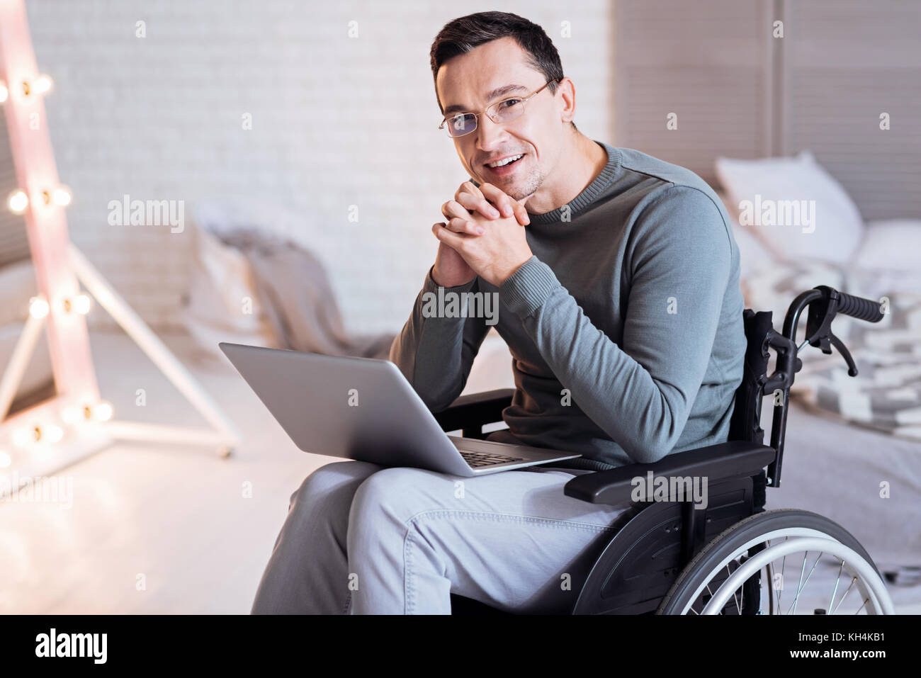 Enigmatical disabled freelancer dreaming about new project Stock Photo ...