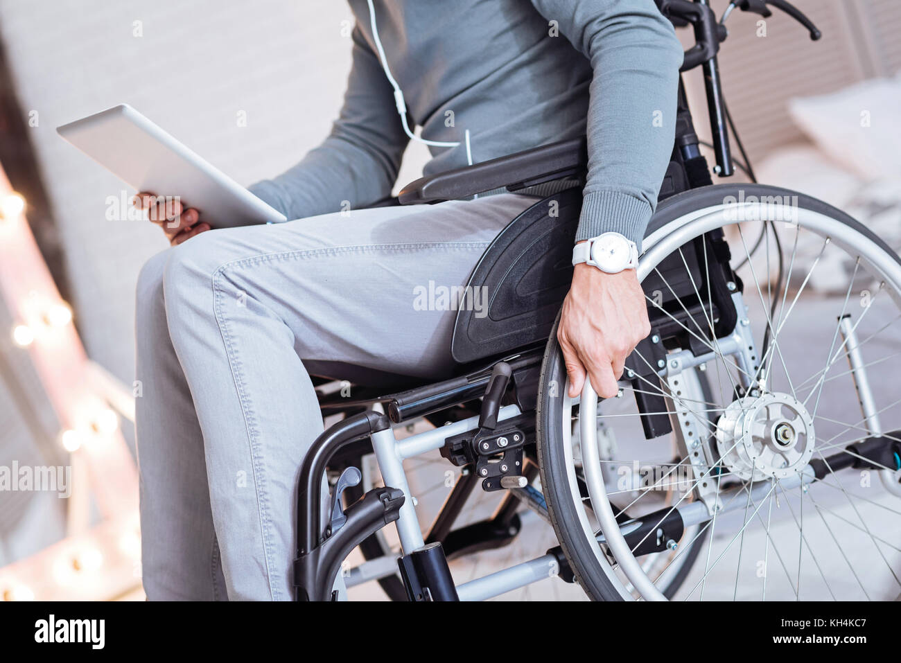 Disabled man holding hand on the wheel Stock Photo - Alamy