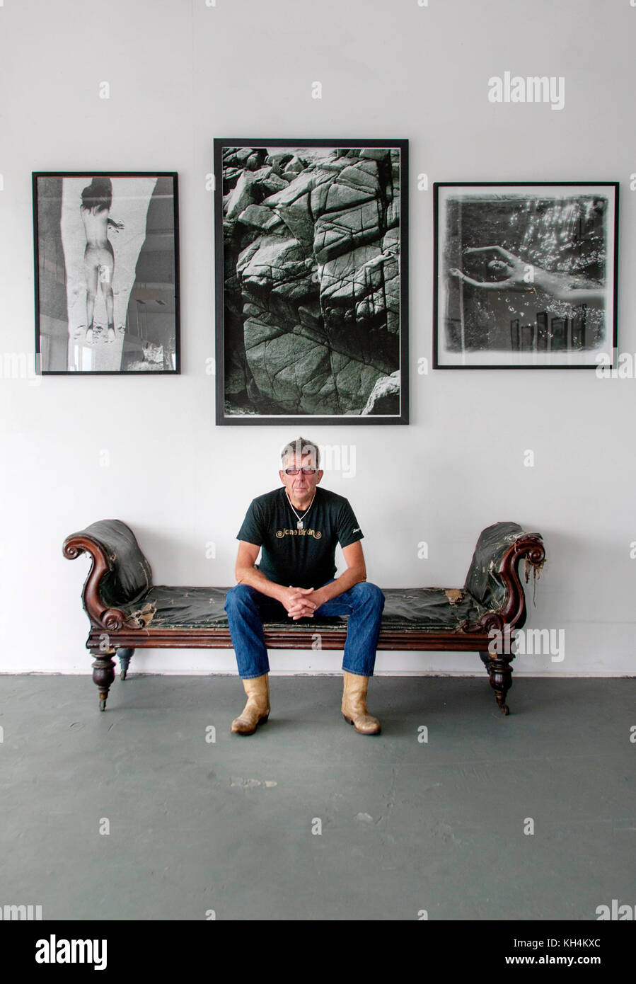 Photographer Charlie Roff in his gallery in Penzance Stock Photo - Alamy