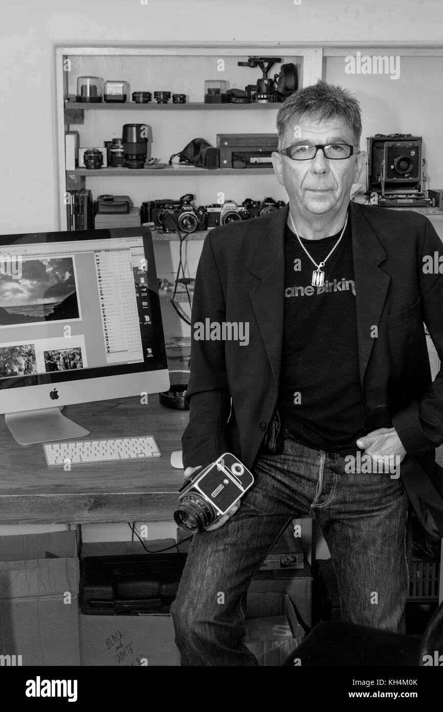 Photographer Charlie Roff in his gallery in Penzance Stock Photo - Alamy