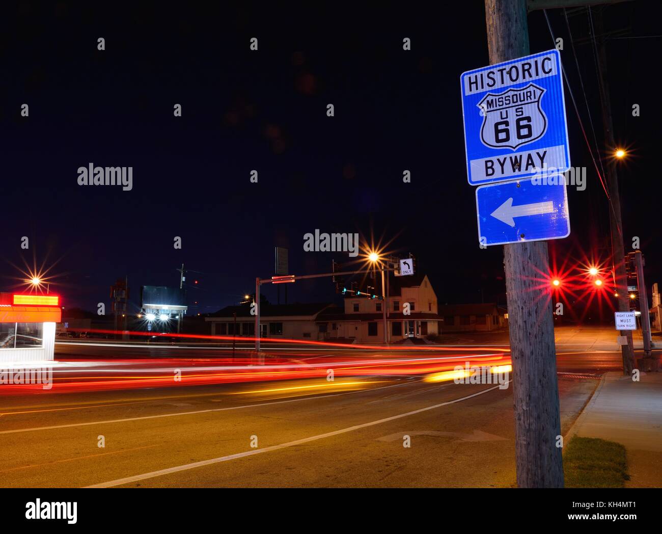 Historic Missouri Route 66 blue Sign at night Stock Photo - Alamy