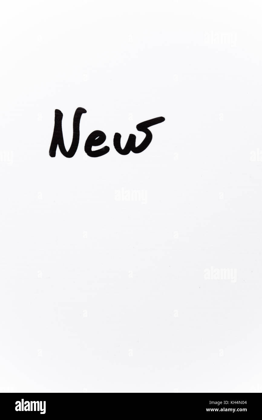 Handwritten word "New" on white background Stock Photo - Alamy