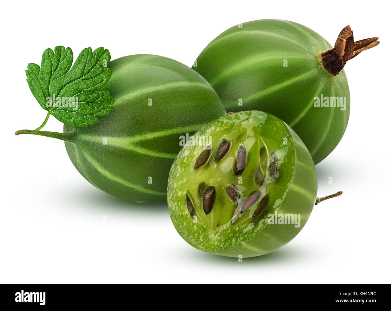 Two ripe green gooseberry and one cut in half with leaf isolated on ...