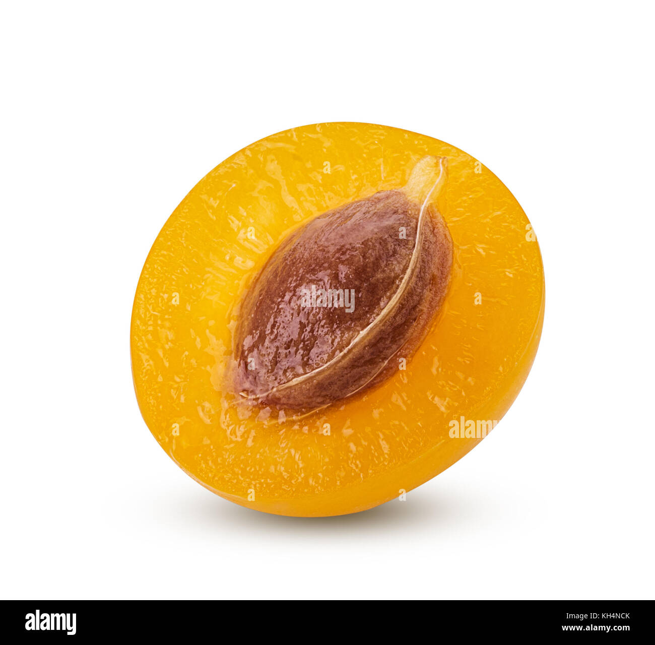 Ripe cherry-plum with bone cut in half isolated on white background ...