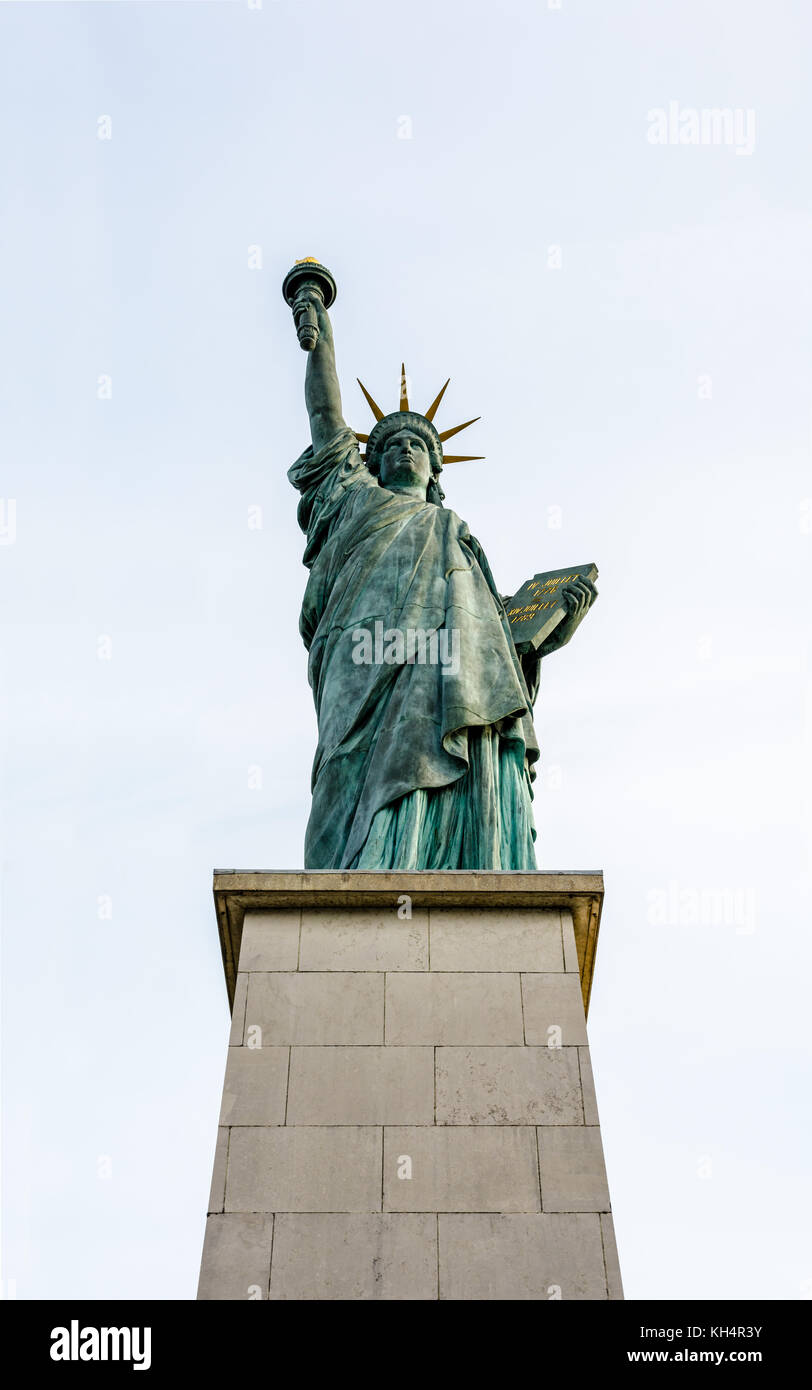 Front view from below of the Statue of Liberty in Paris against a light ...