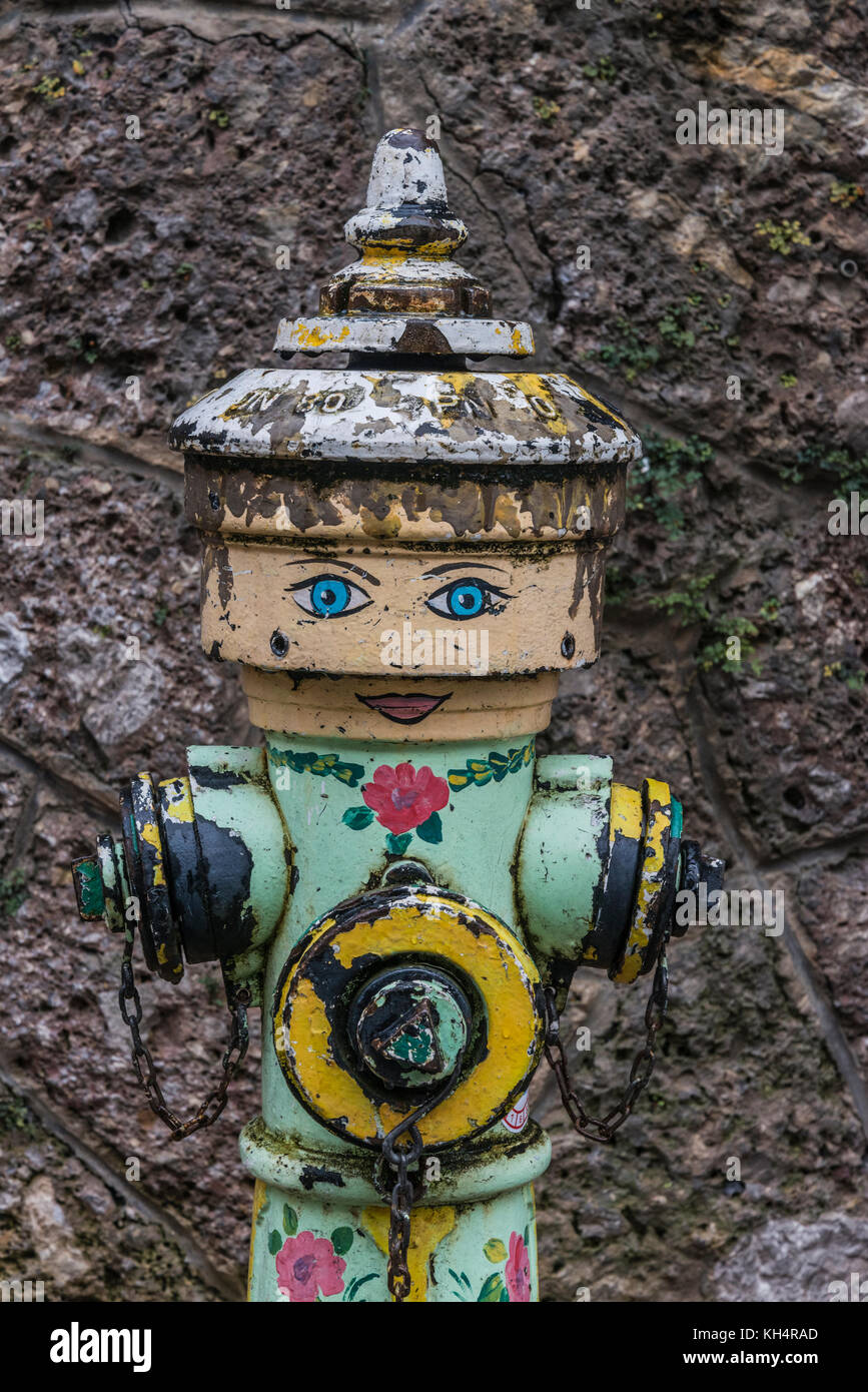 Street scene with decorated fire hydrant in the old medieval city of ...
