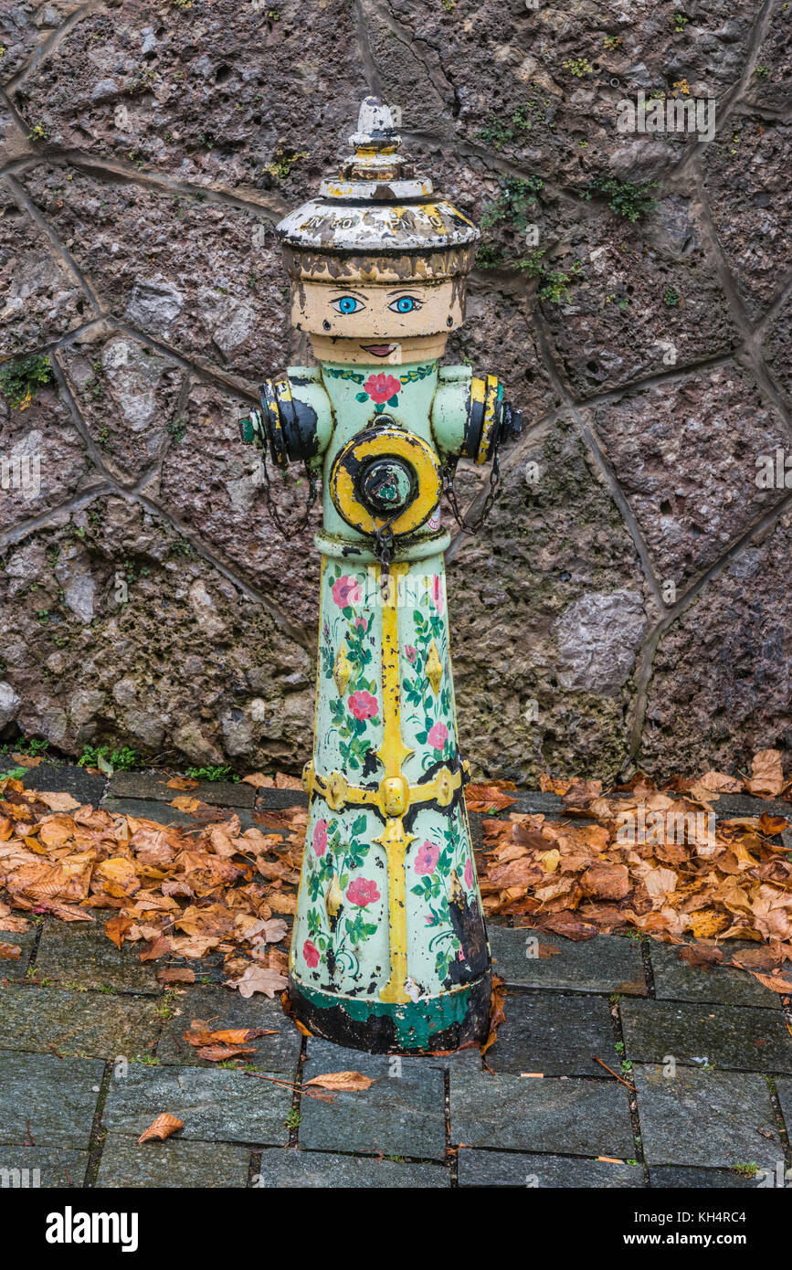 Street scene with decorated fire hydrant in the old medieval city of ...