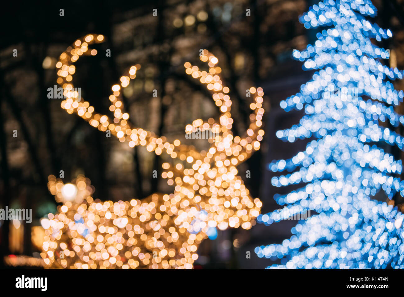 Defocused Bokeh Background With Many Festive Lights Lamps In Shape Deer ...
