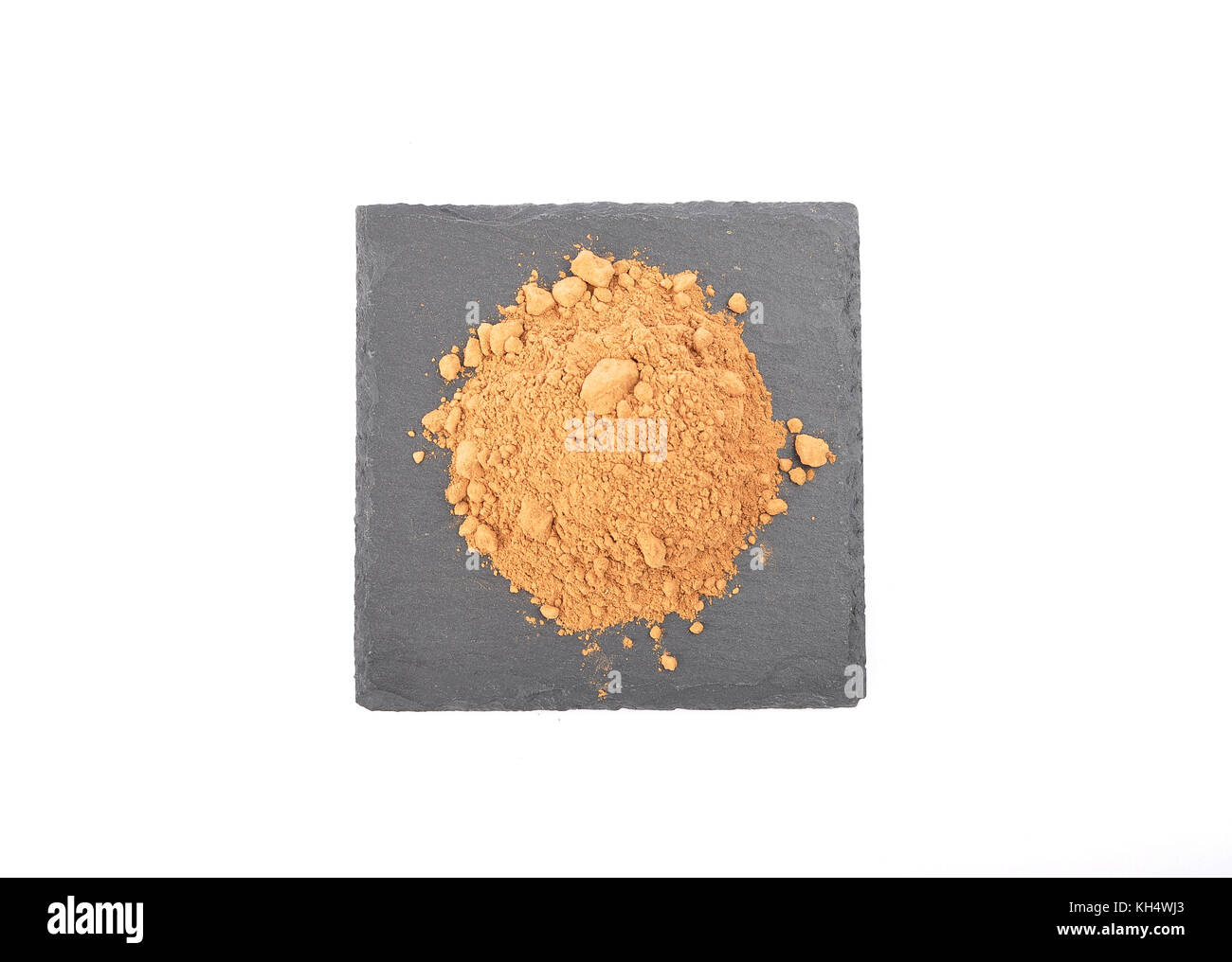 Carob powder on shale and white Stock Photo - Alamy