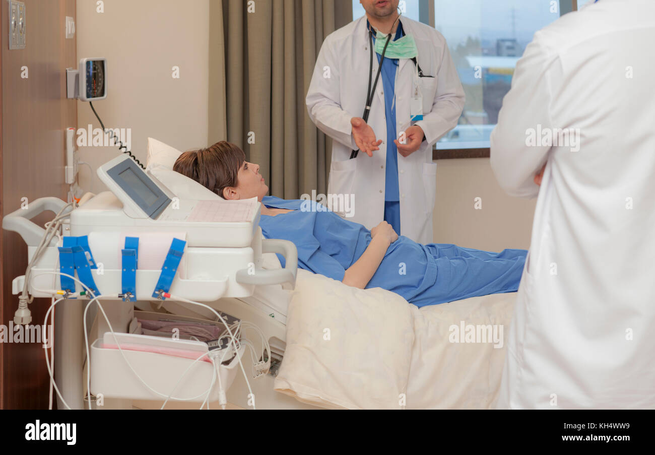 A patient is listening to a doctor, hand and torso only, in modern ...