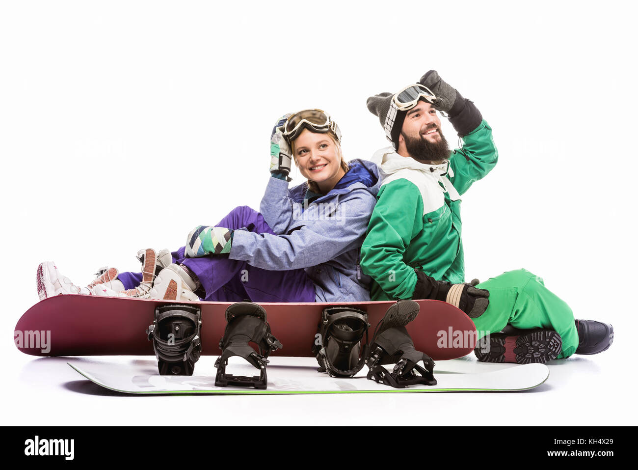 couple in snowboarding costumes with snowboards Stock Photo - Alamy