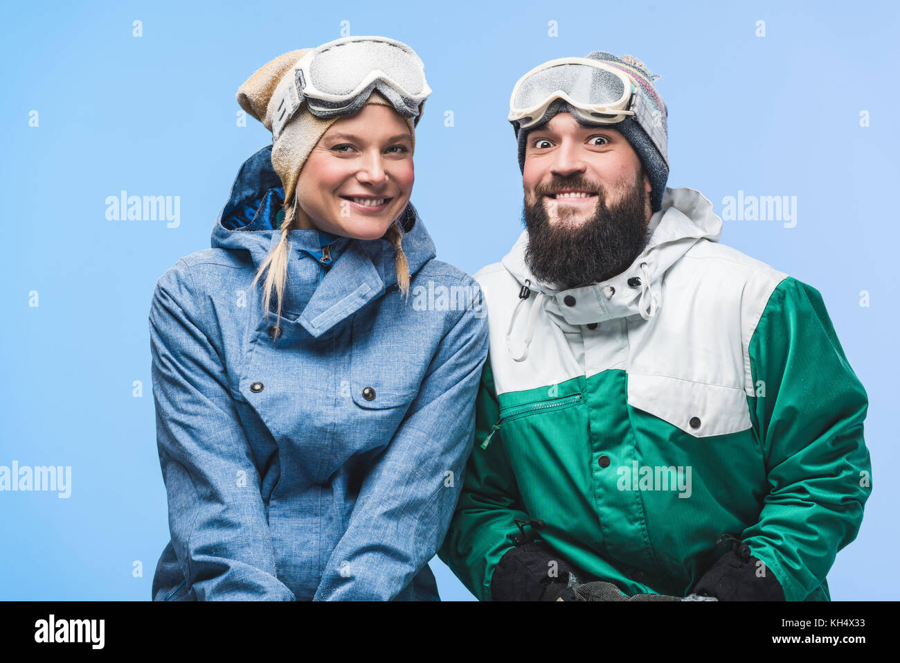 smiling couple in snowboard clothing Stock Photo - Alamy