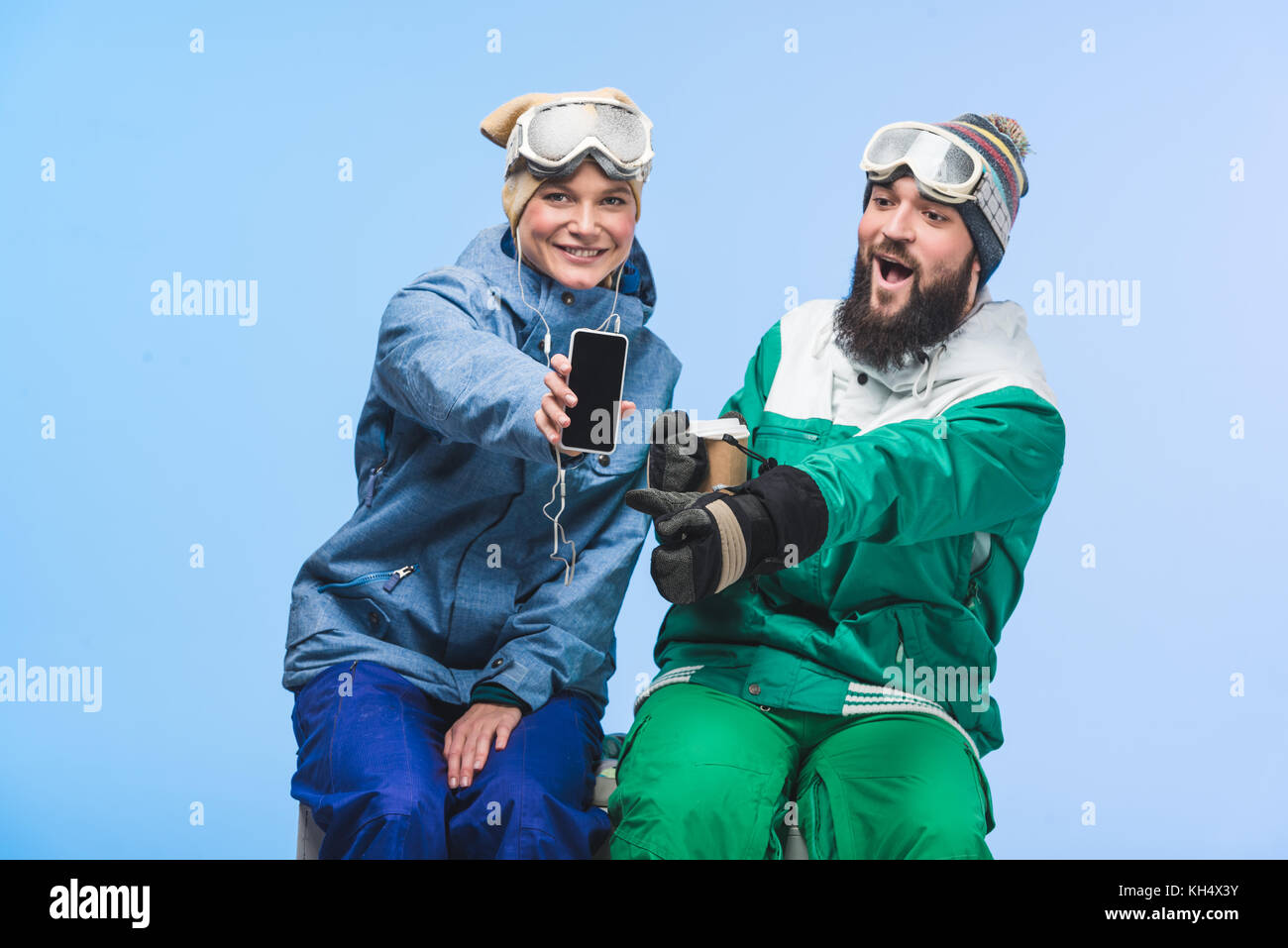 young couple in snowboarding clothing Stock Photo - Alamy