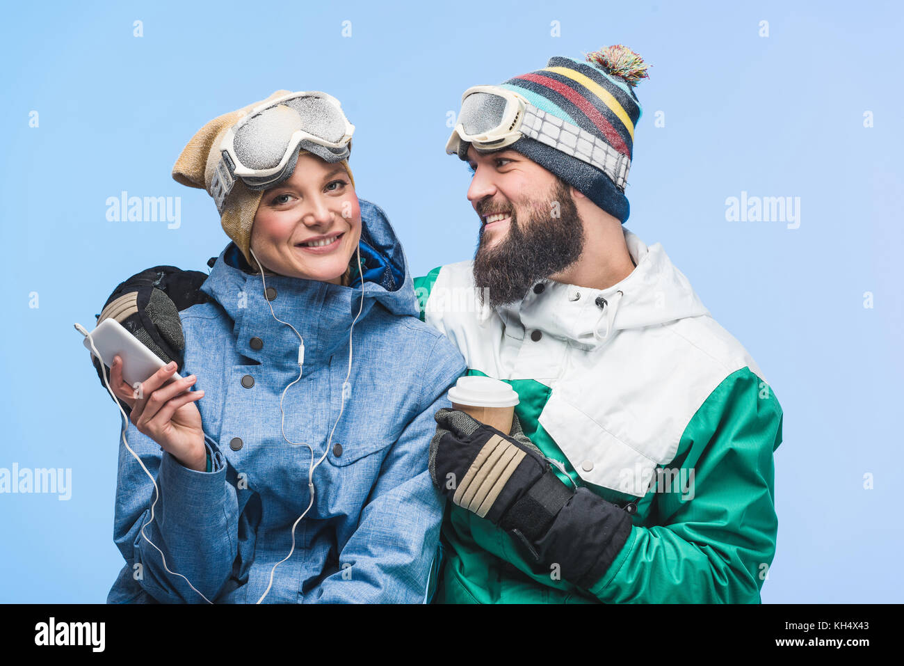 young couple in snowboarding clothing Stock Photo - Alamy