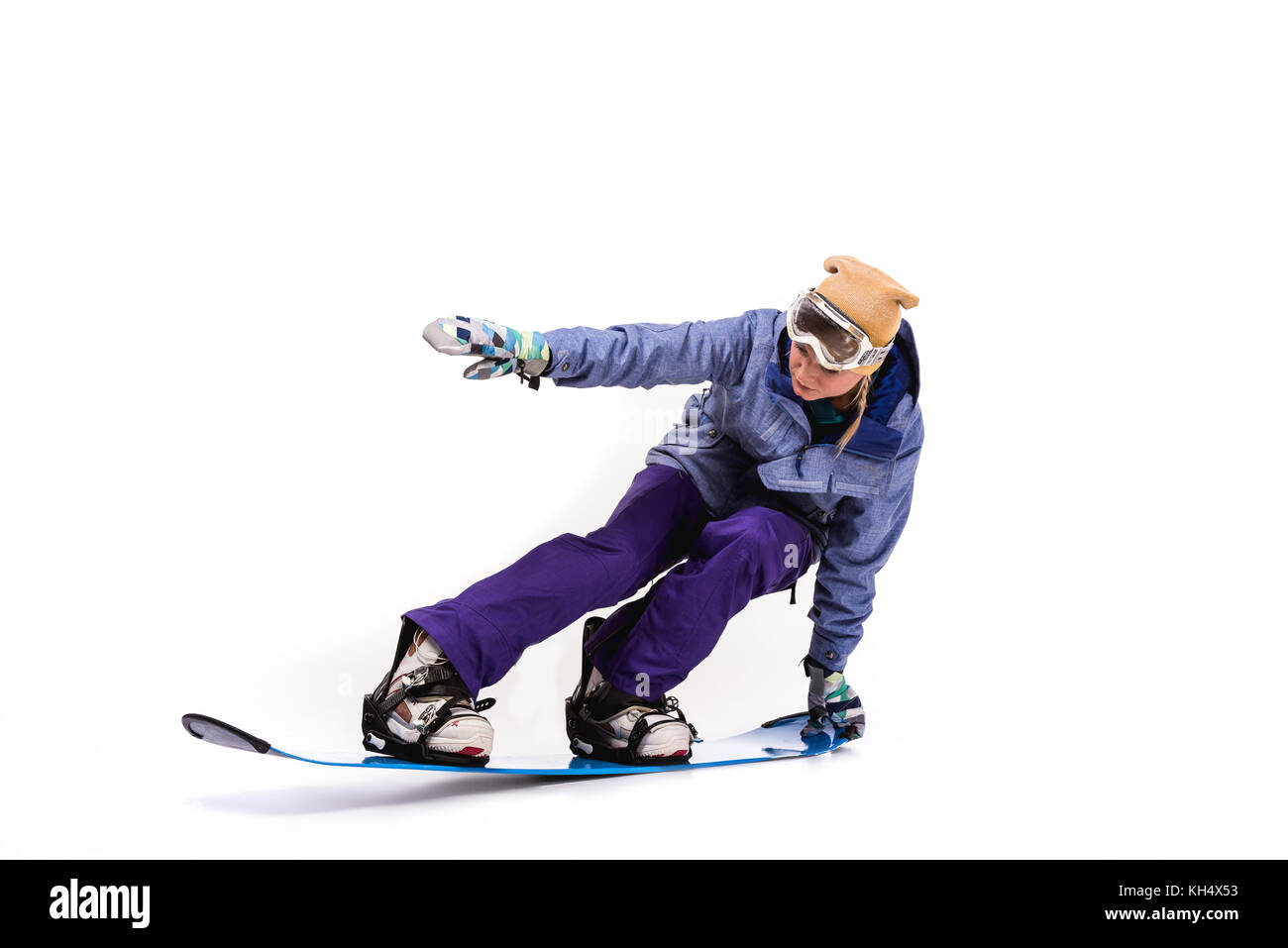 woman sliding on snowboard Stock Photo - Alamy