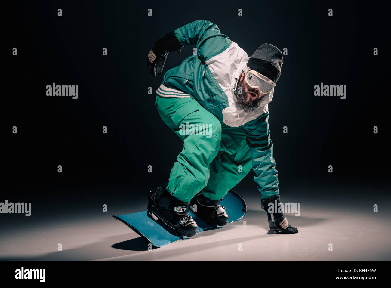snowboarder practicing on snowboard Stock Photo - Alamy