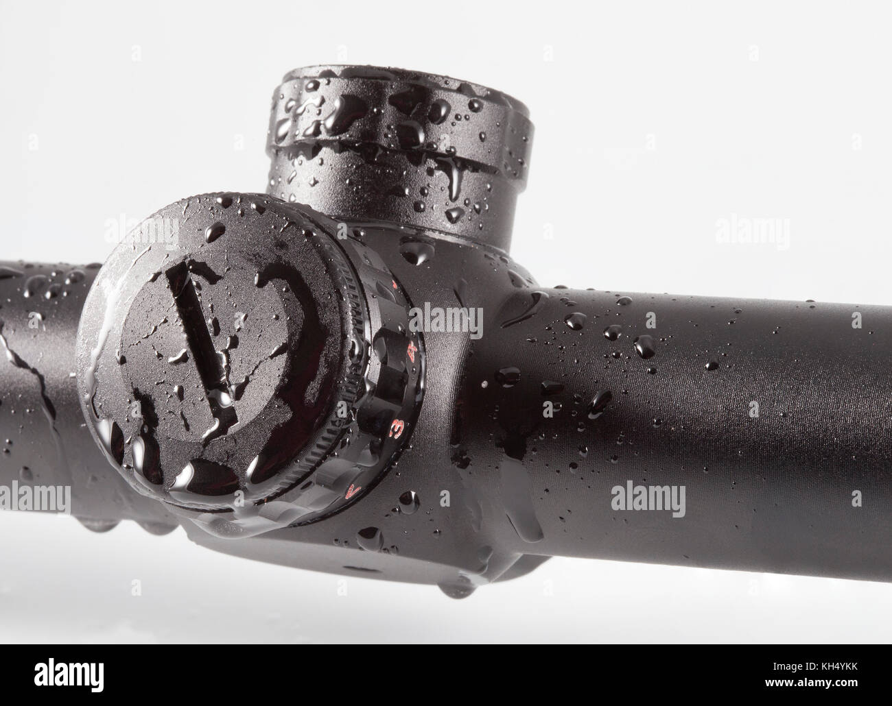 Water on the reticle brightness knob on a rifle scope Stock Photo - Alamy