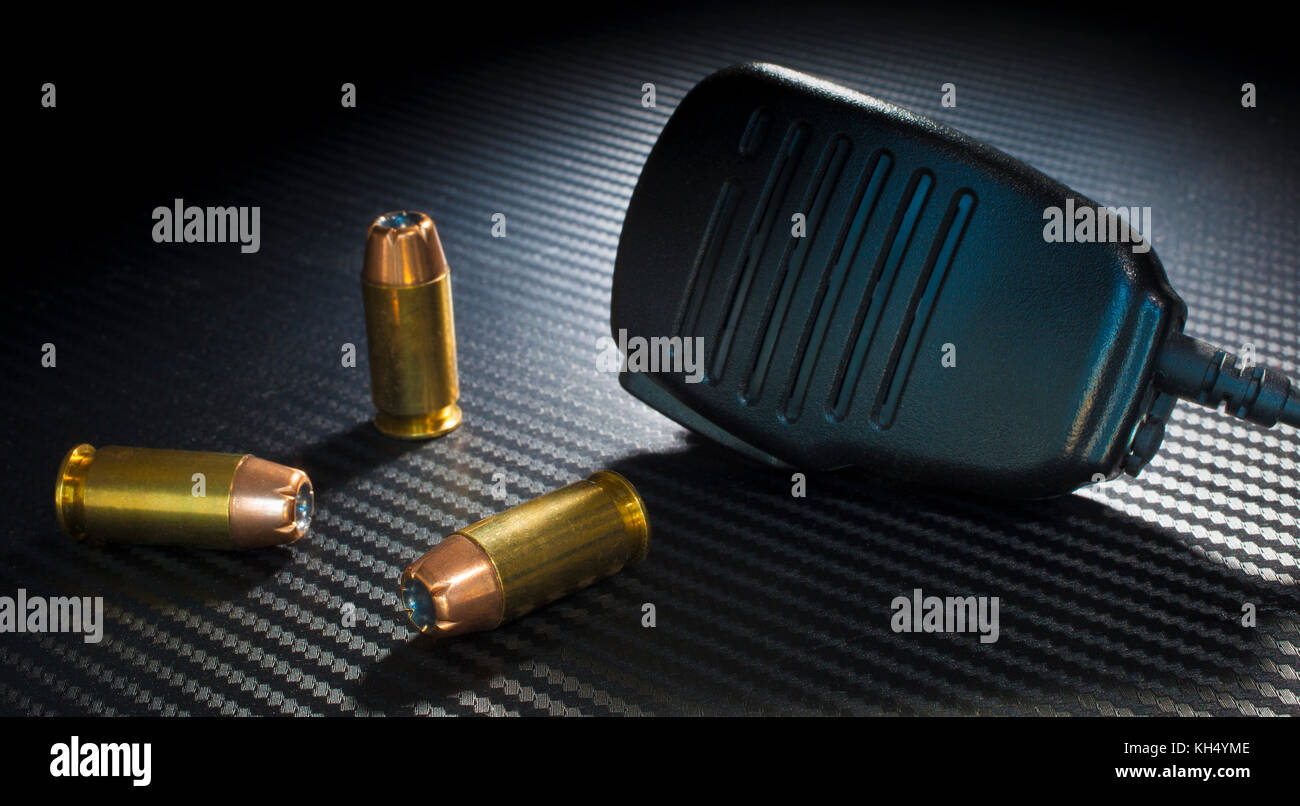 Police style microphone with center fire handgun cartridges Stock Photo ...