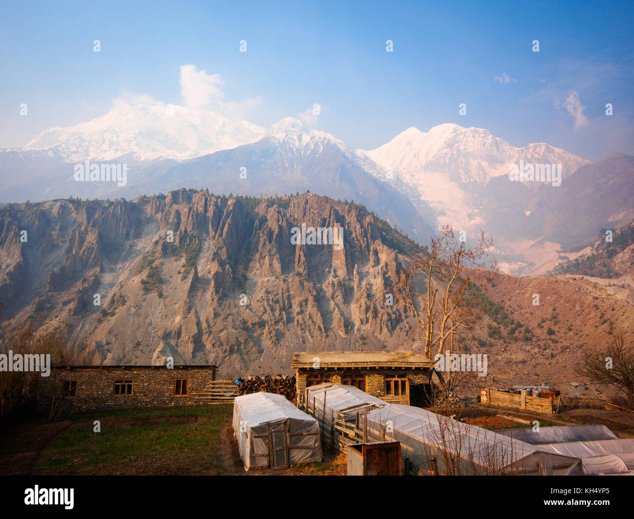 View over garden in Manang with hot houses for vegetable cultivation to ...