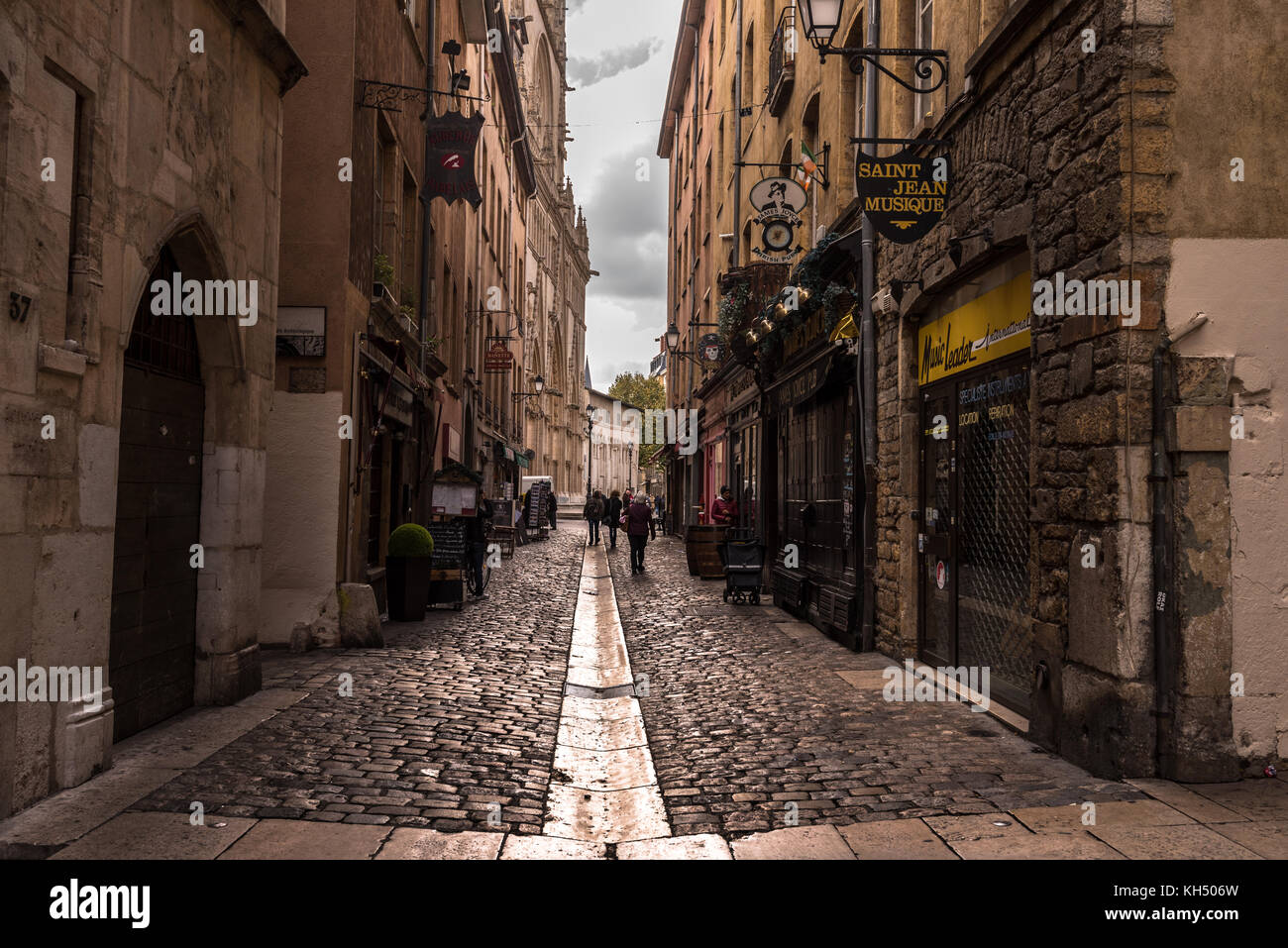 Lyon, France--November 6, 2017--Shops and Restaurants around a narrow ...