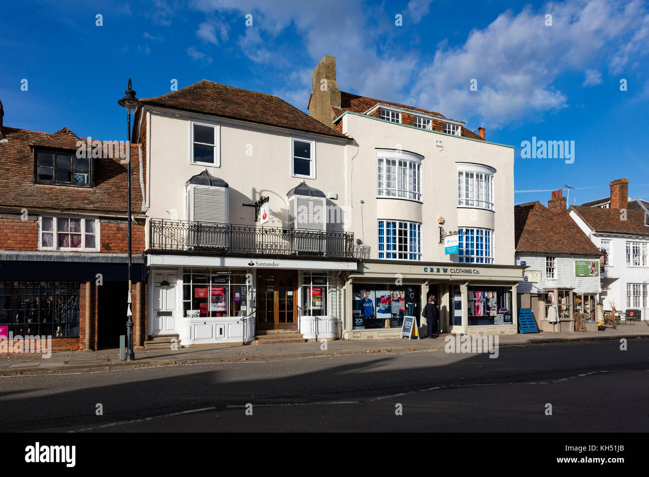 Santander Bank and Crew Clothing shop in traditional old buildings on ...