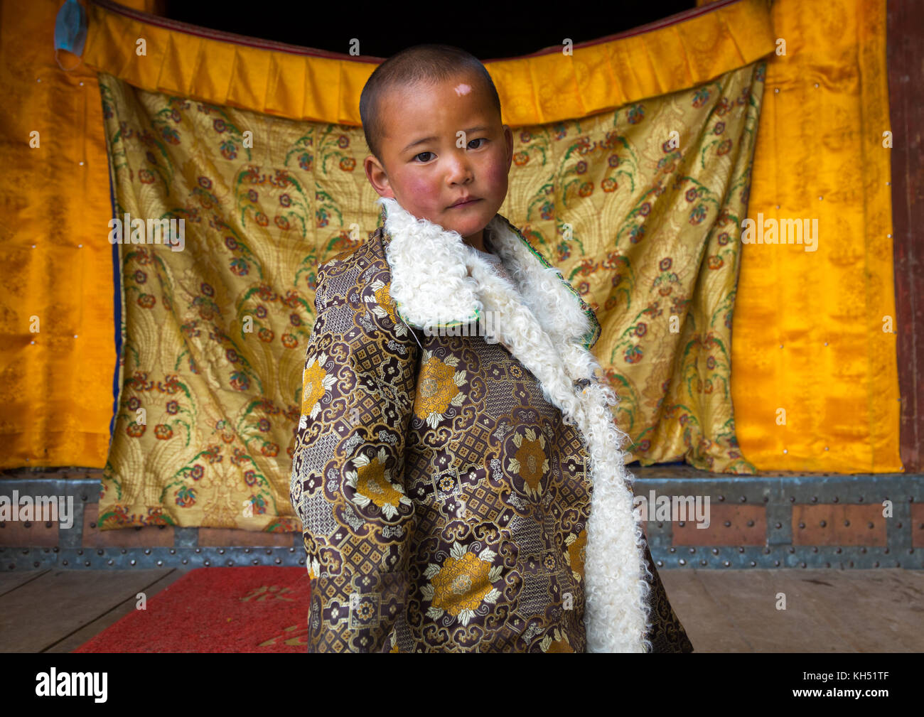 Tibetan child boy in traditional clothing in Shachong monastery ...