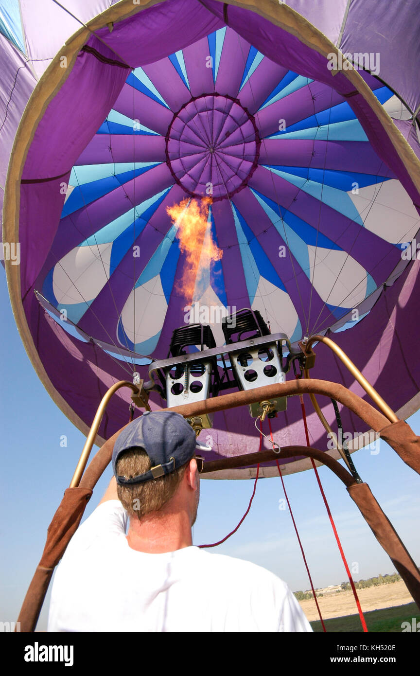 Ground crew preparing a hot air balloon before takeoff Stock Photo - Alamy