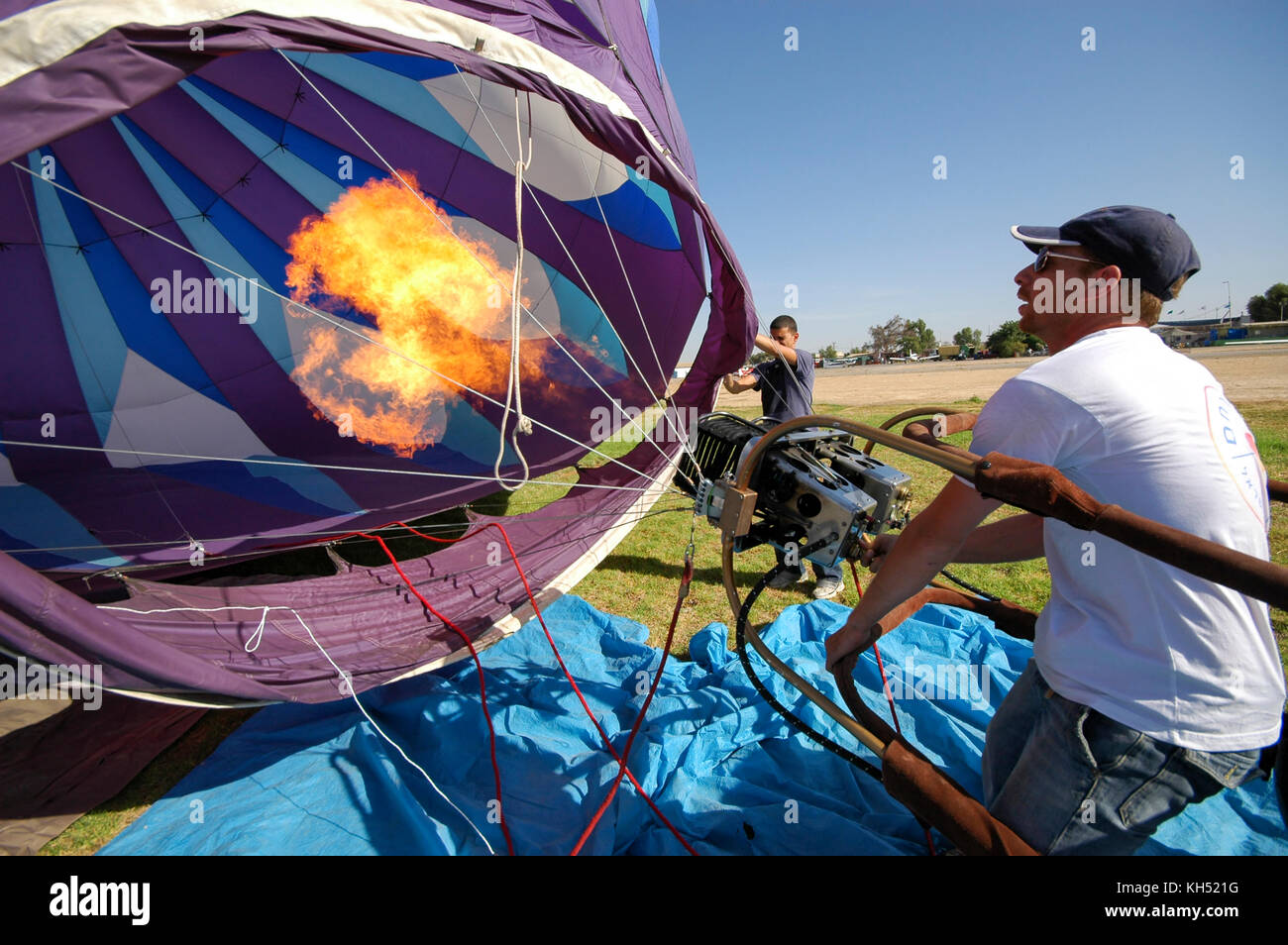 Ground crew preparing a hot air balloon before takeoff Stock Photo - Alamy
