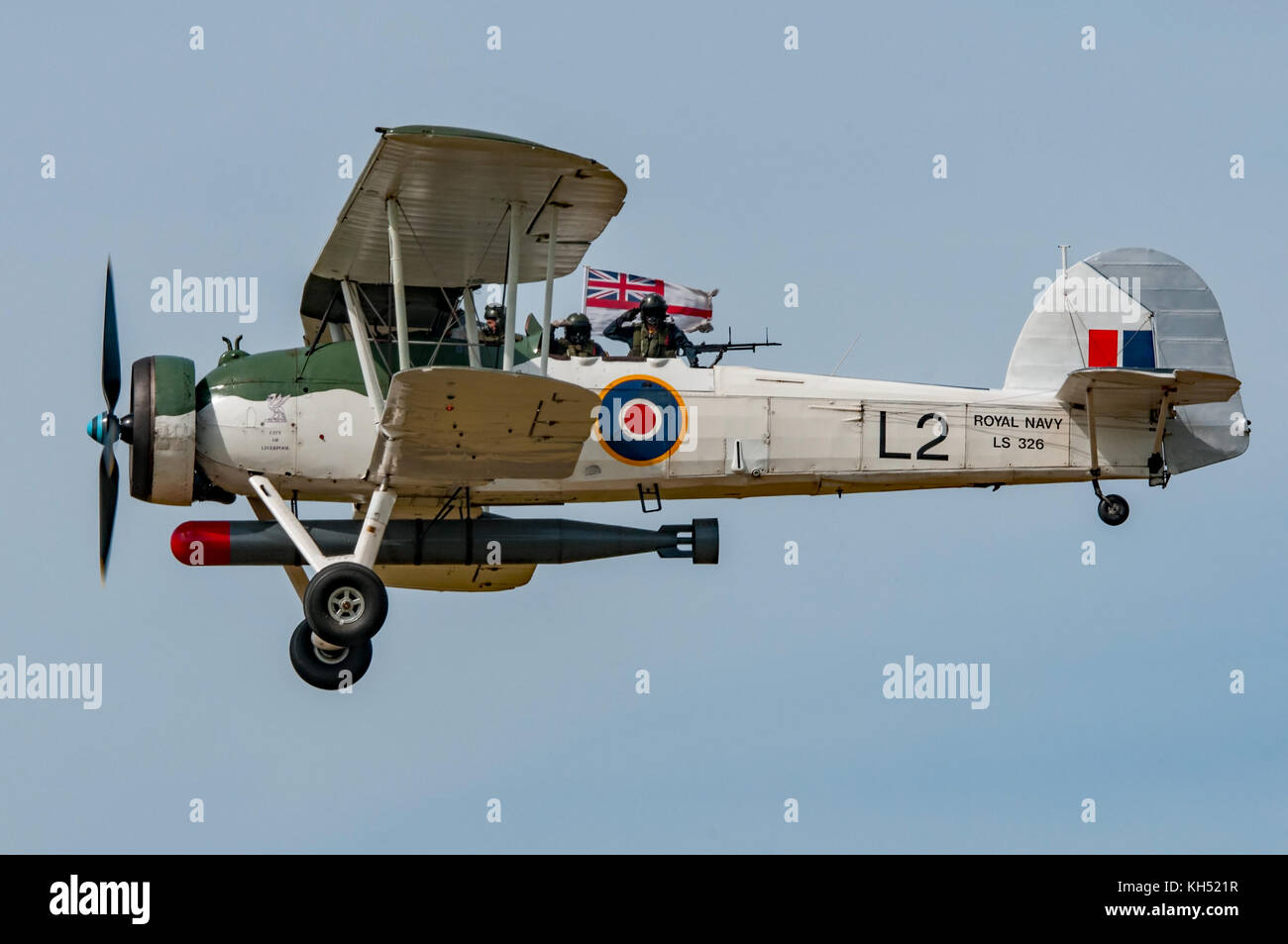 A British Royal Navy Swordfish Torpedo Bomber crew take the salute at ...