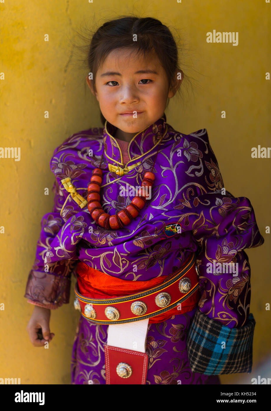 Tibetan child girl with a huge necklace, Tongren County, Rebkong, China ...