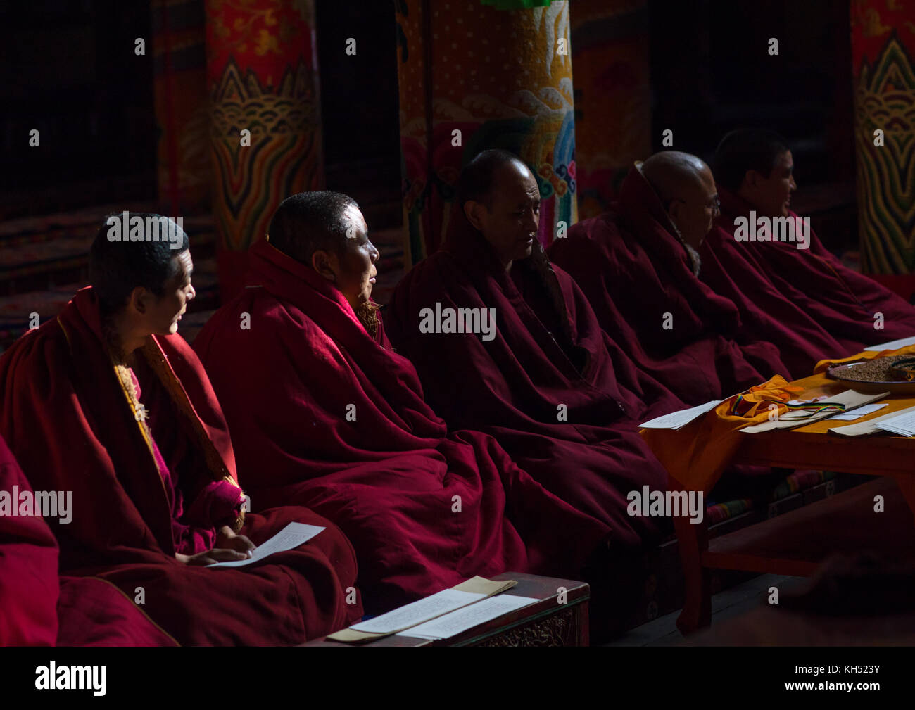 Monks praying and meditating inside Longwu monastery, Tongren County ...
