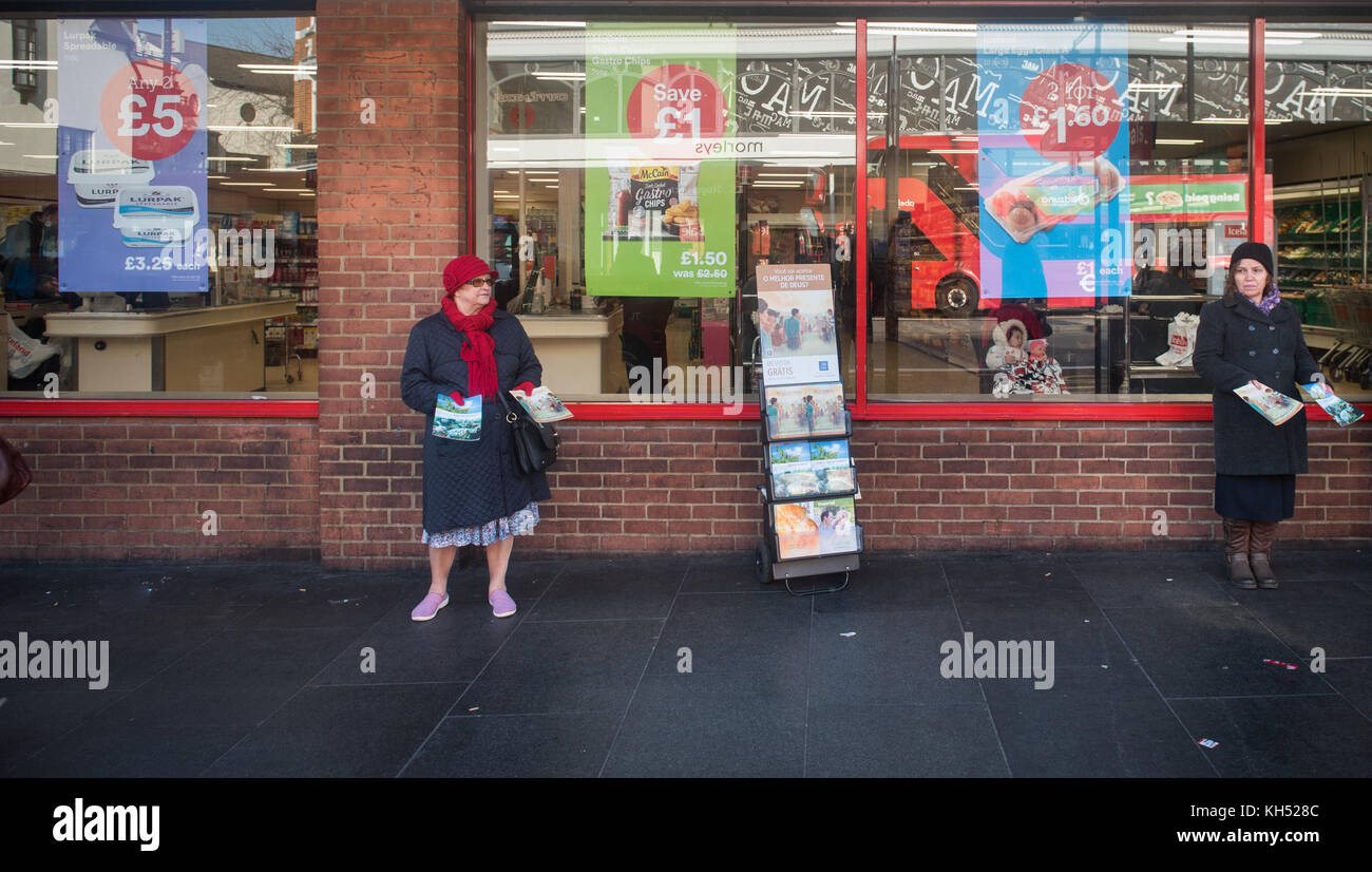 Jehovas Witnesses selling the Watchtower in Brixton, London, UK Stock ...