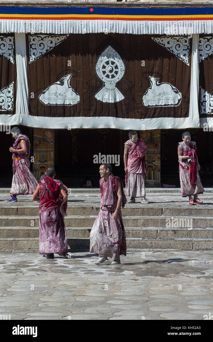 Tibetan monks enjoying a water fight after the yearly renovation of the ...