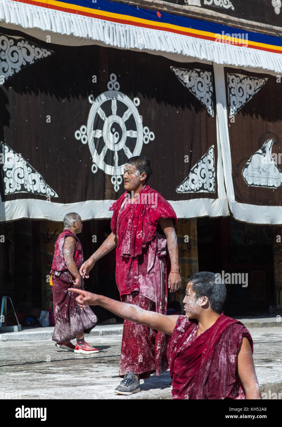 Tibetan monks enjoying a water fight after the yearly renovation of the ...