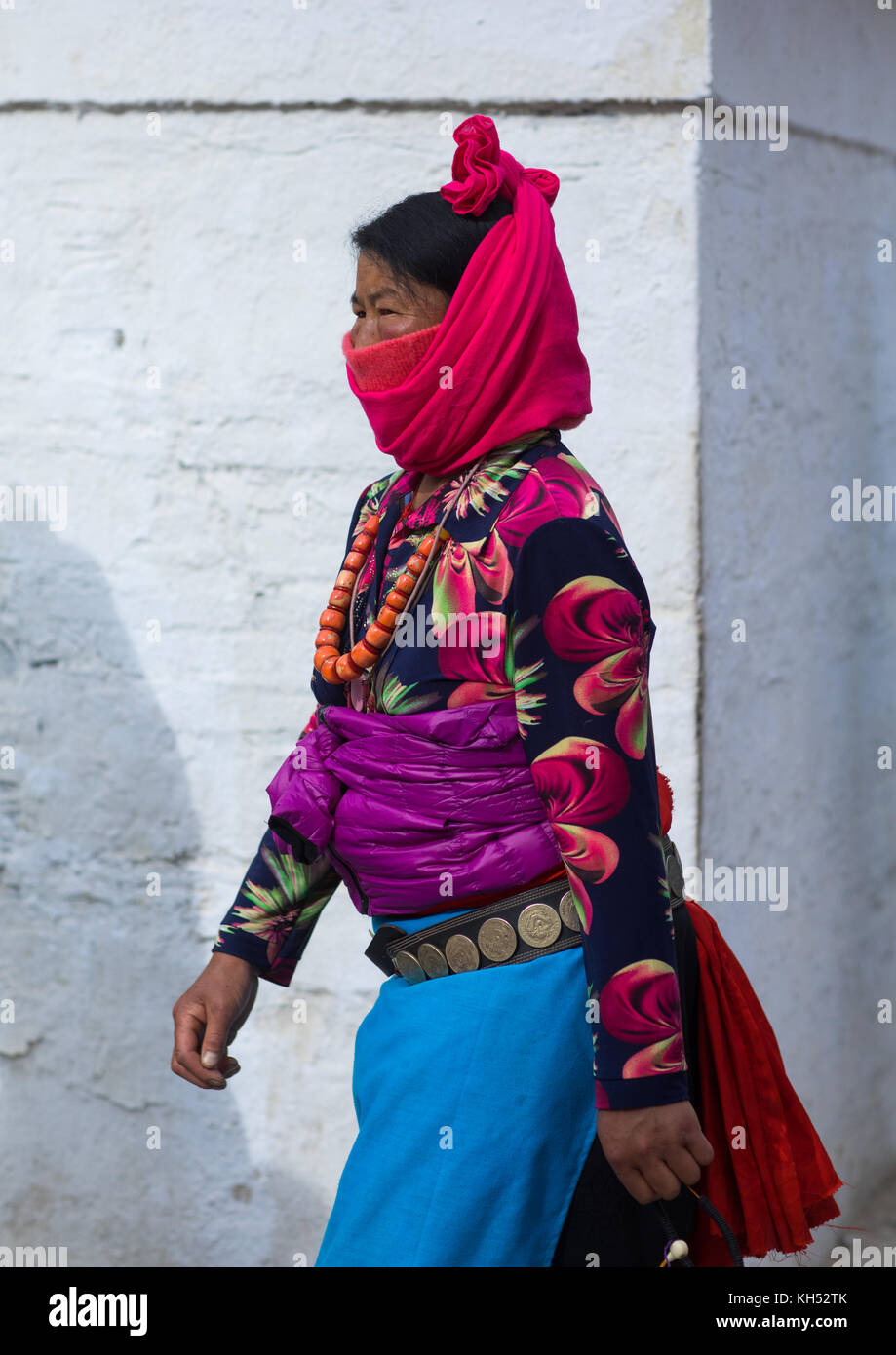Tibetan pilgrim at the kora at Labrang monastery, Gansu province ...