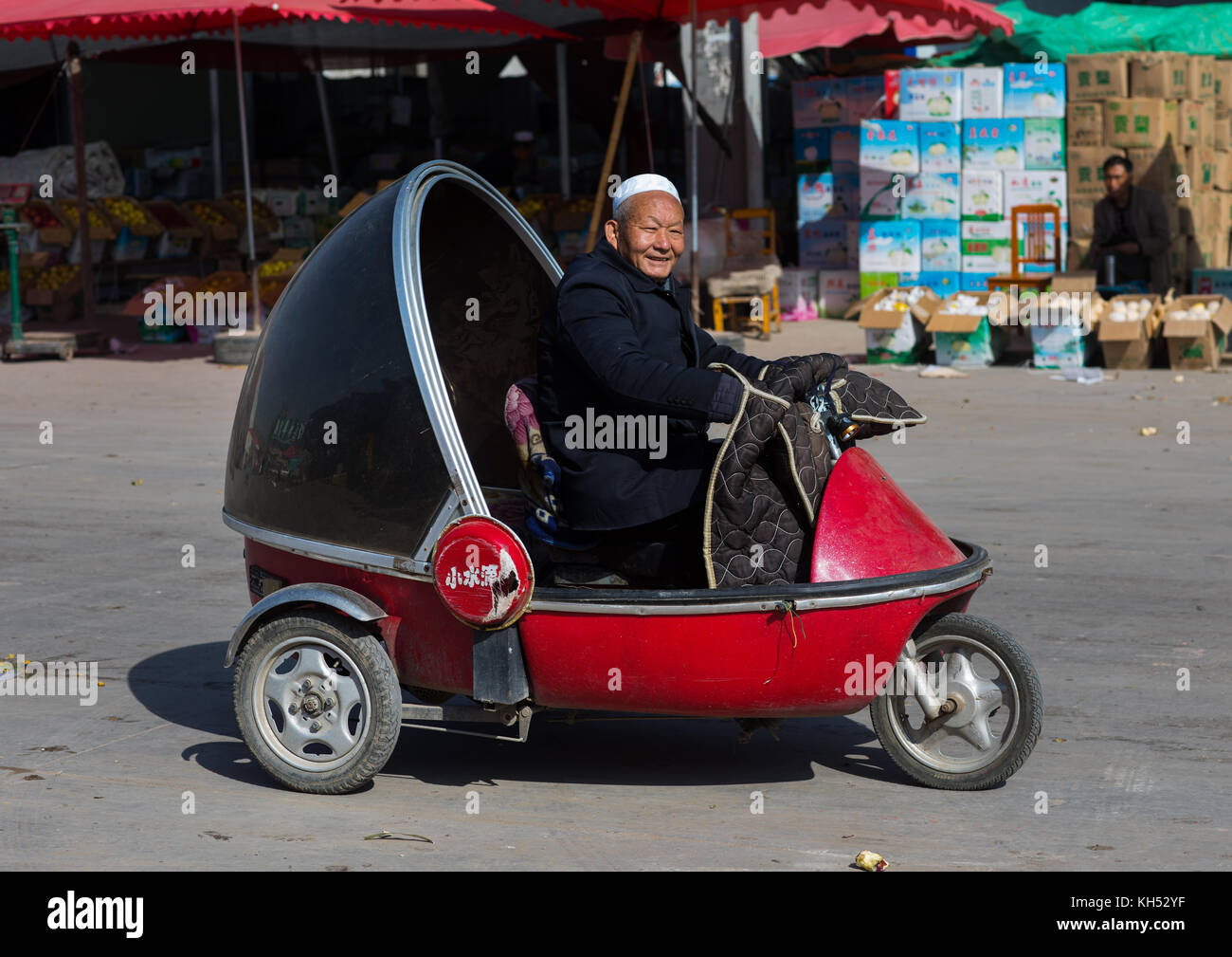 Cute small three-wheeled chinese retro car in the street, Gansu ...