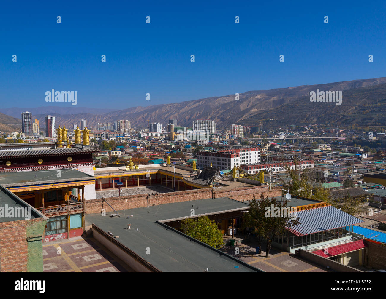 Rongwo monastery in front of the modern town, Tongren County, Longwu ...