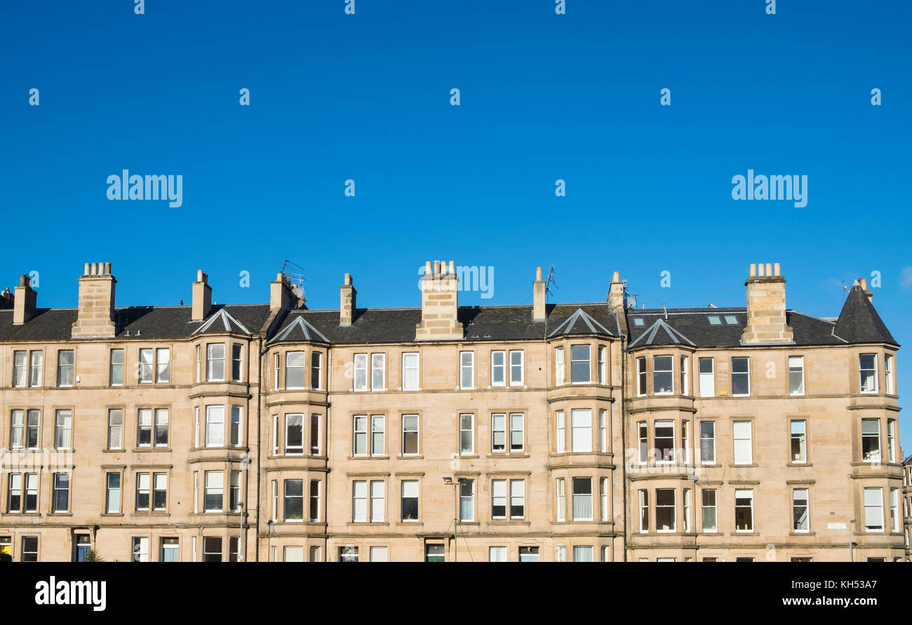 View of row of sandstone terraced apartments (tenements) on Comely Bank ...