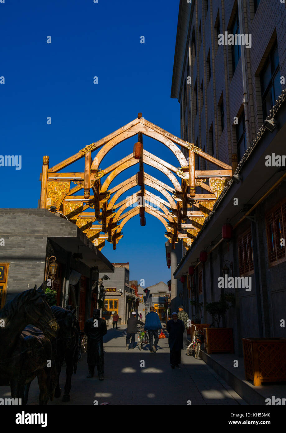 Wooden archway in the renovated old chinese quarter, Gansu province ...
