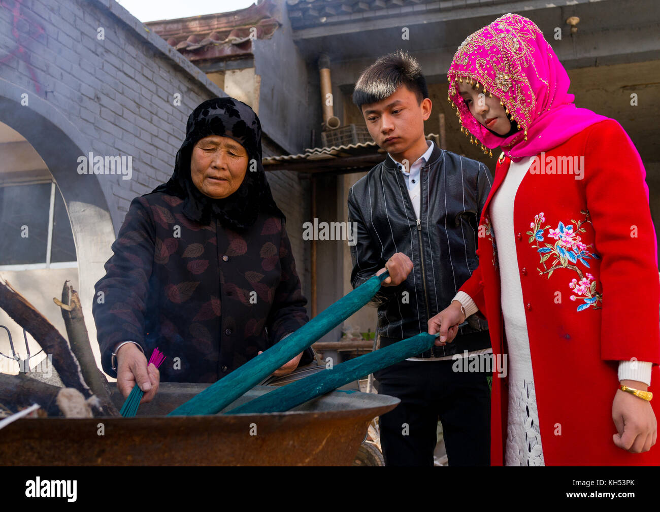 Hui muslim people burning incense stick in Yu Baba Gongbei shrine ...