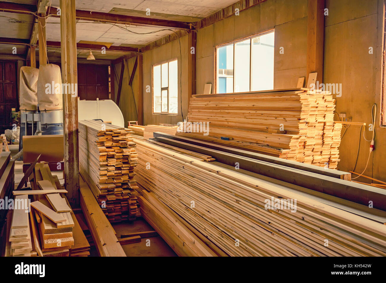 Inside woodworking workshop with lumber in front Stock Photo - Alamy