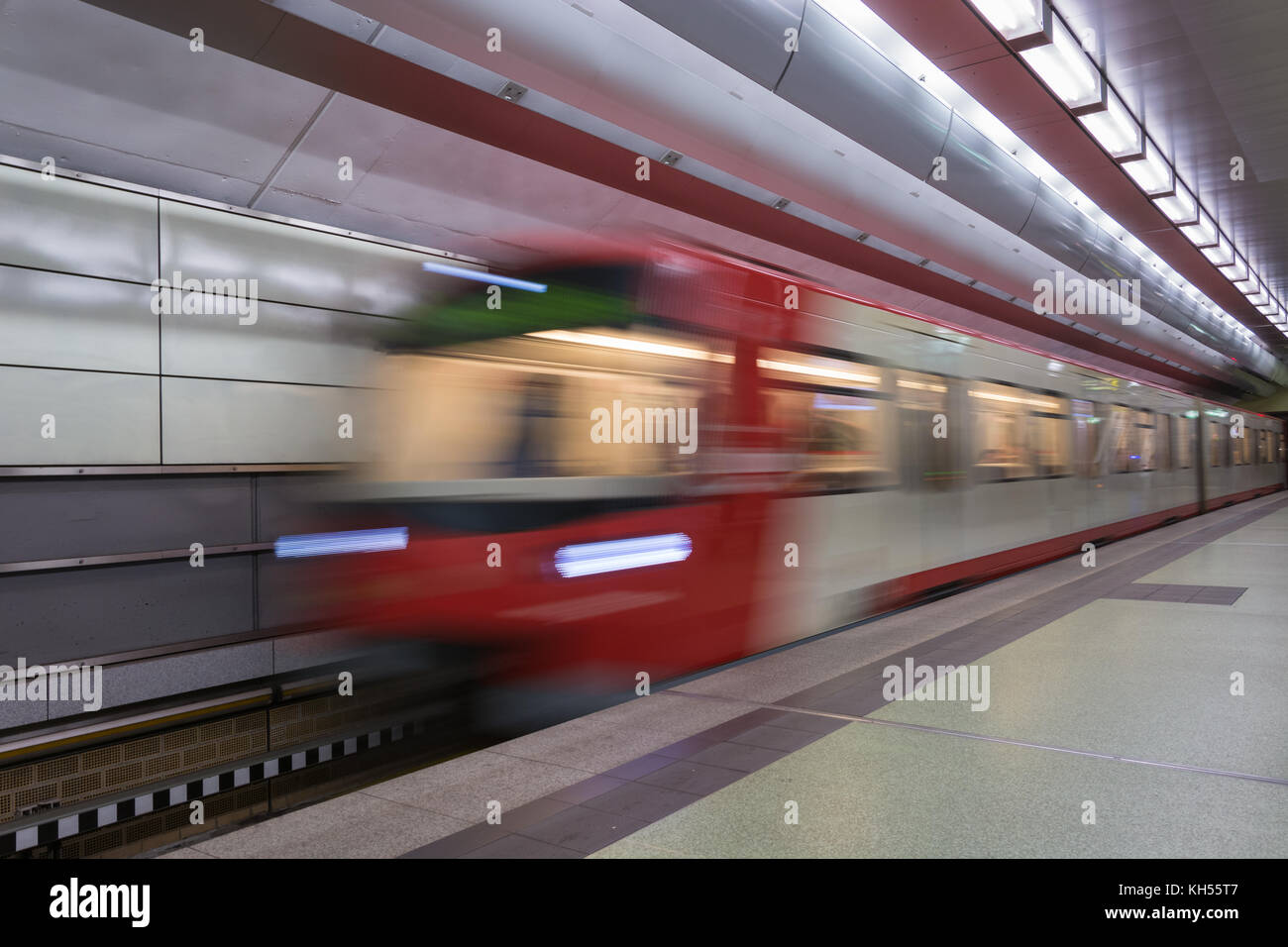 Moving red and white subway in the underground from the side Stock ...